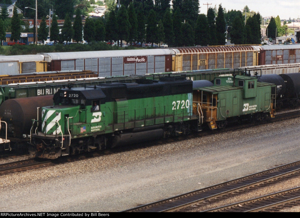 Engine & Caboose rolling through the yard